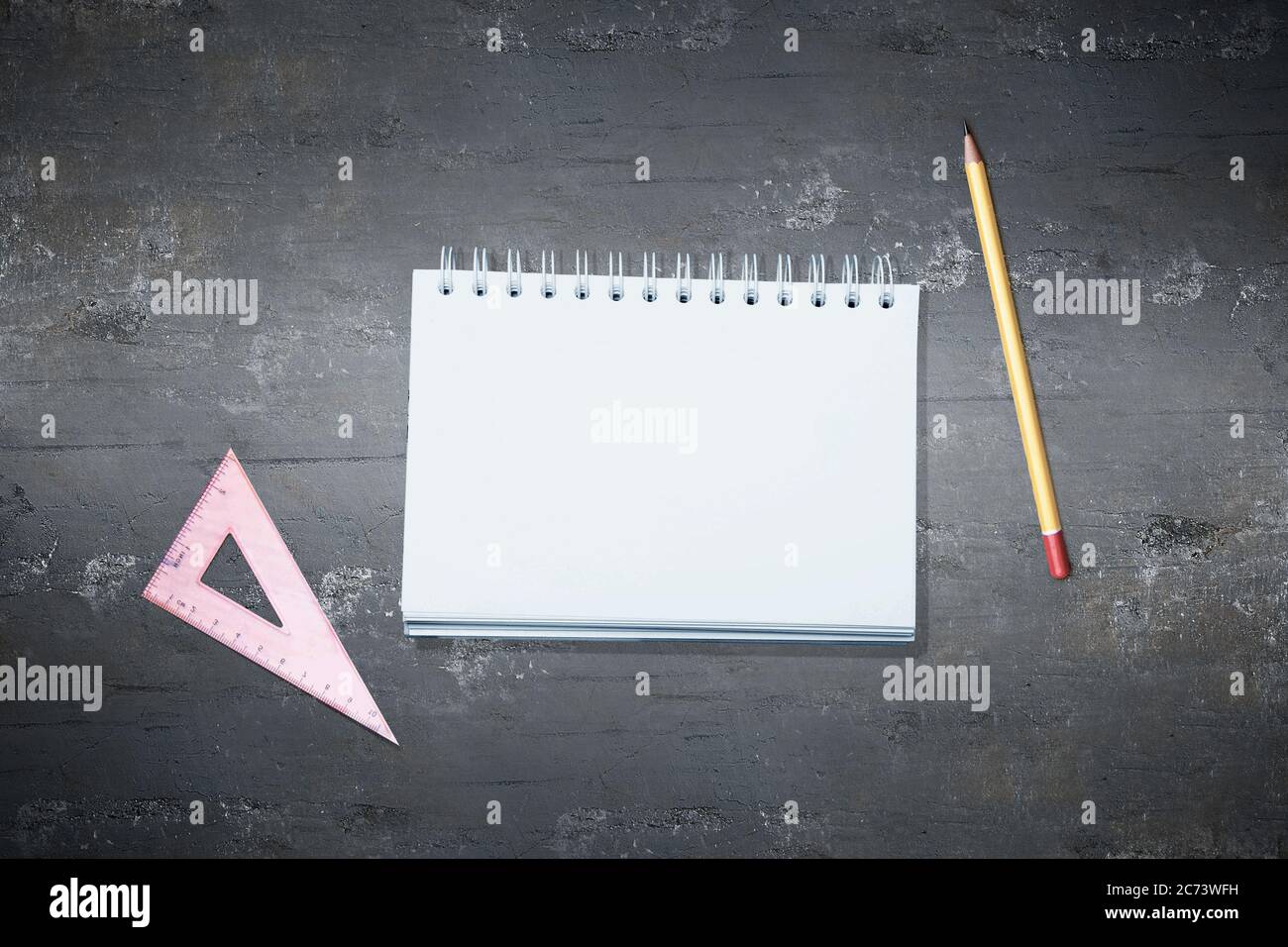 Notepad, pencil, and a ruler with a black background. Back to School ...