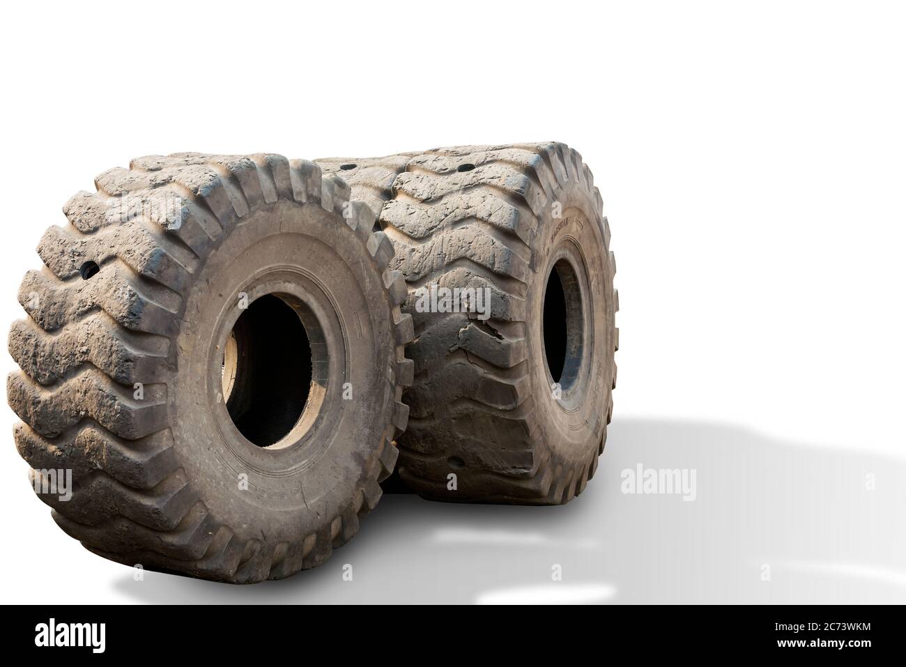 Old tractor tire isolated over white background Stock Photo - Alamy