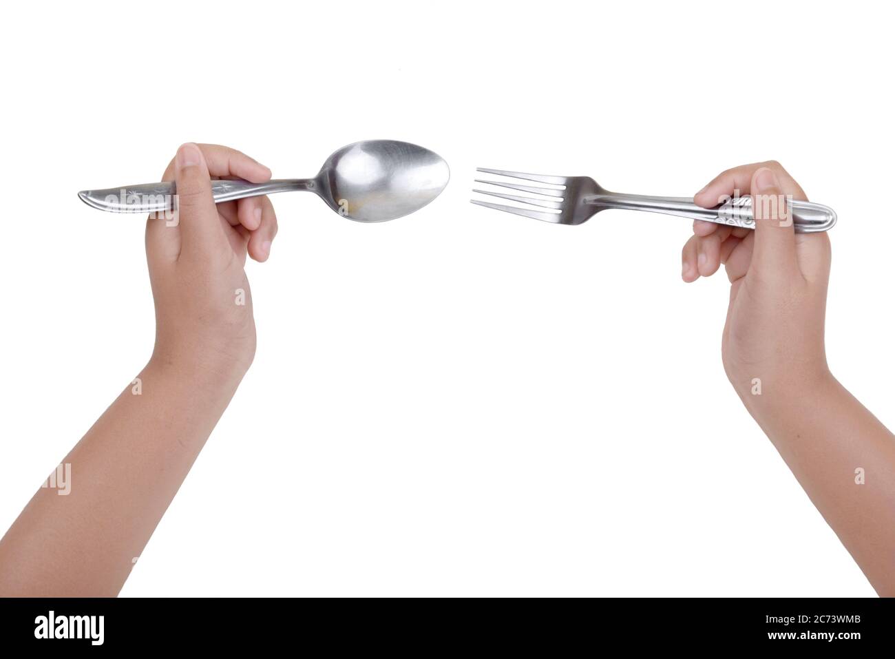 Hands holding spoon and fork isolated over white background Stock Photo ...