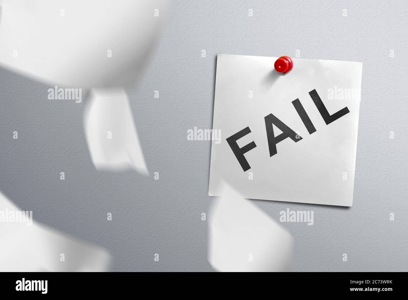 Paper with Fail text hanging on the wall Stock Photo - Alamy