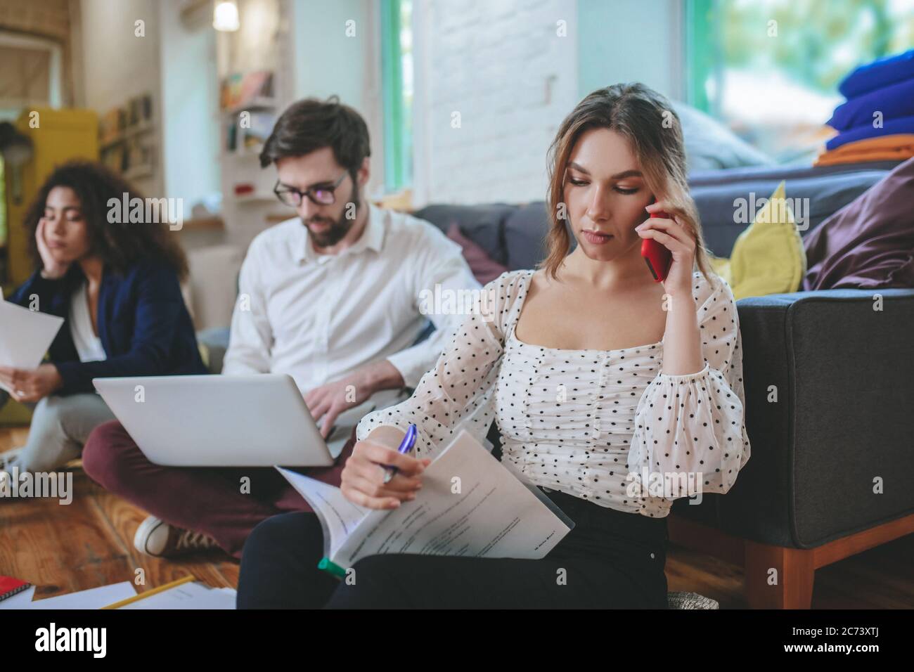Two young woman working with papers hi-res stock photography and images ...