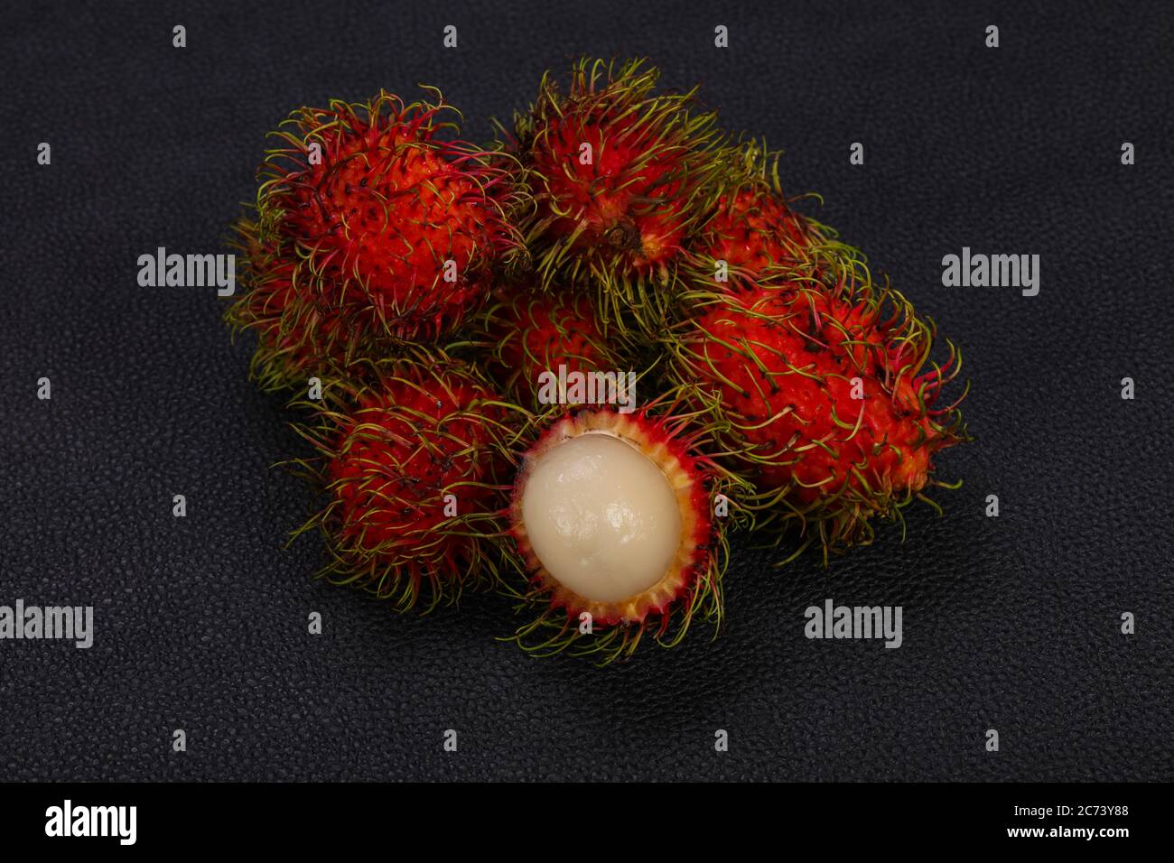 Tropical sweet exotic fruit Rambutan heap Stock Photo - Alamy