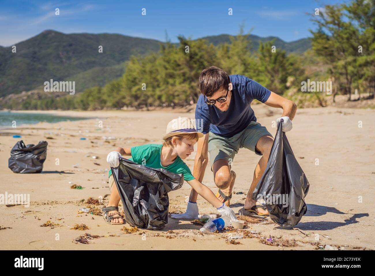 Children Collecting Rubbish High Resolution Stock Photography and ...