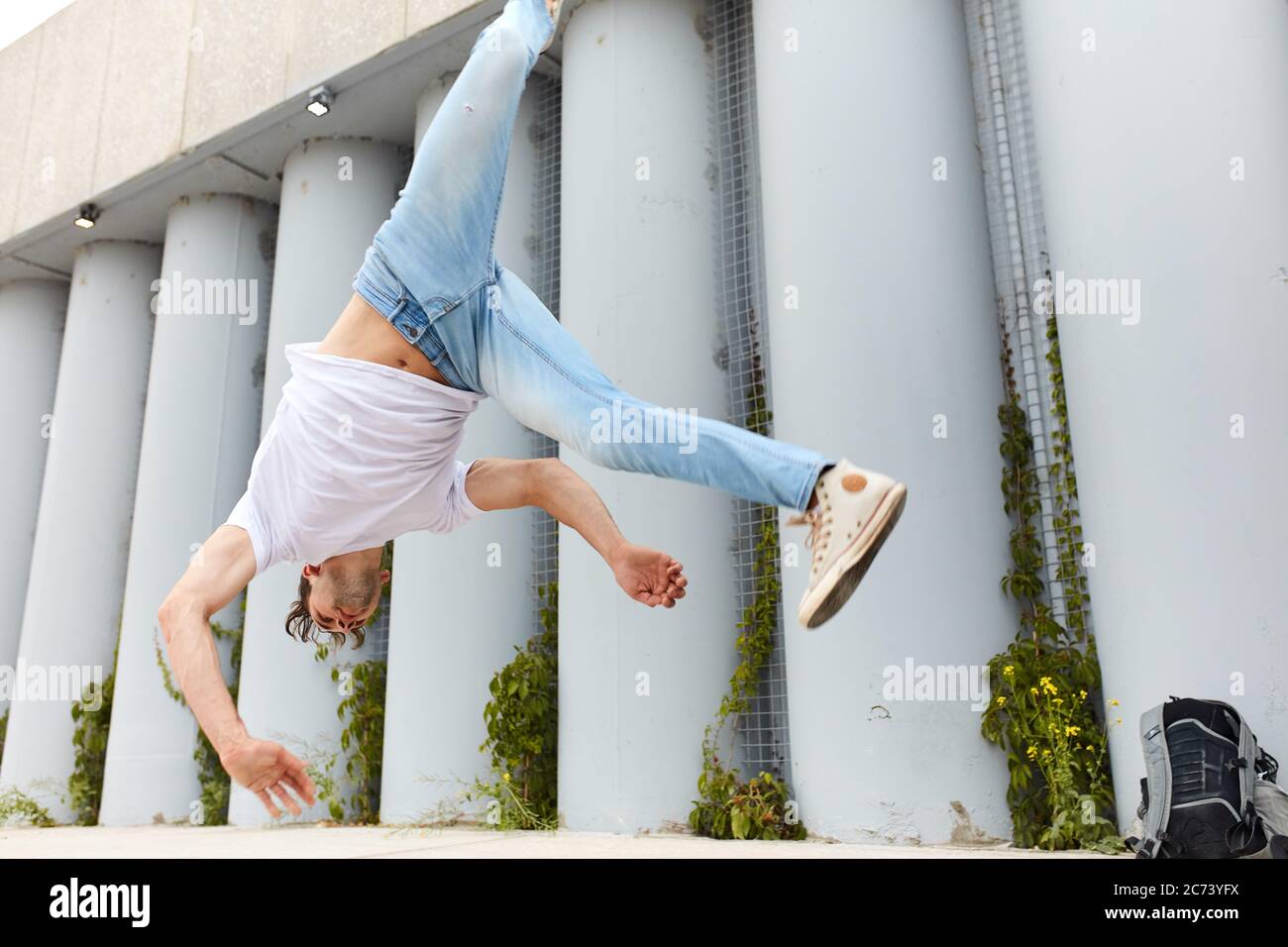 dancer doing a movement, man falling down while performing a flip ...