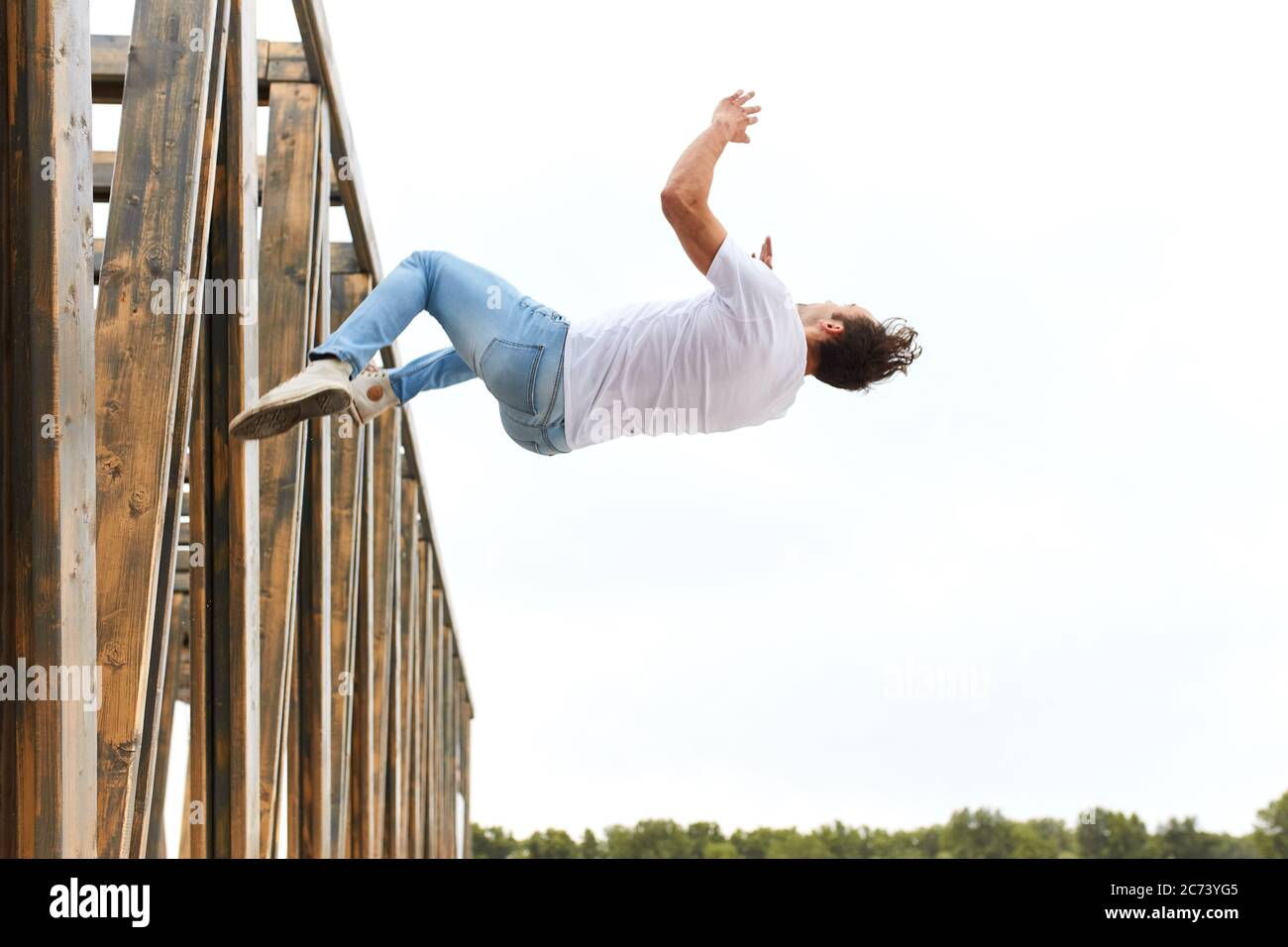 young ambitious man taking part in the stunt battle, full length side ...
