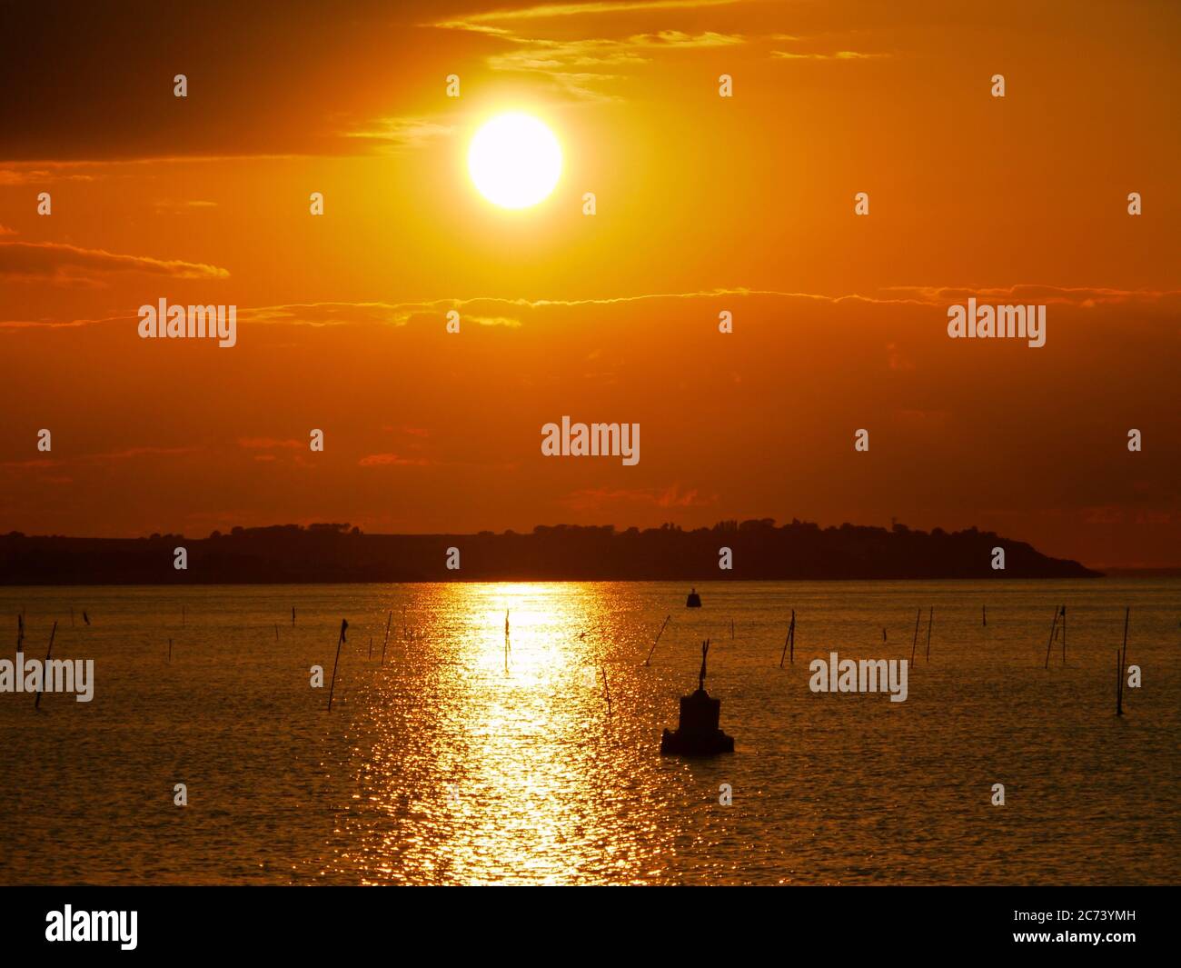 Sunset over Whitstable, Kent, UK, looking towards the Isle of Sheppey ...