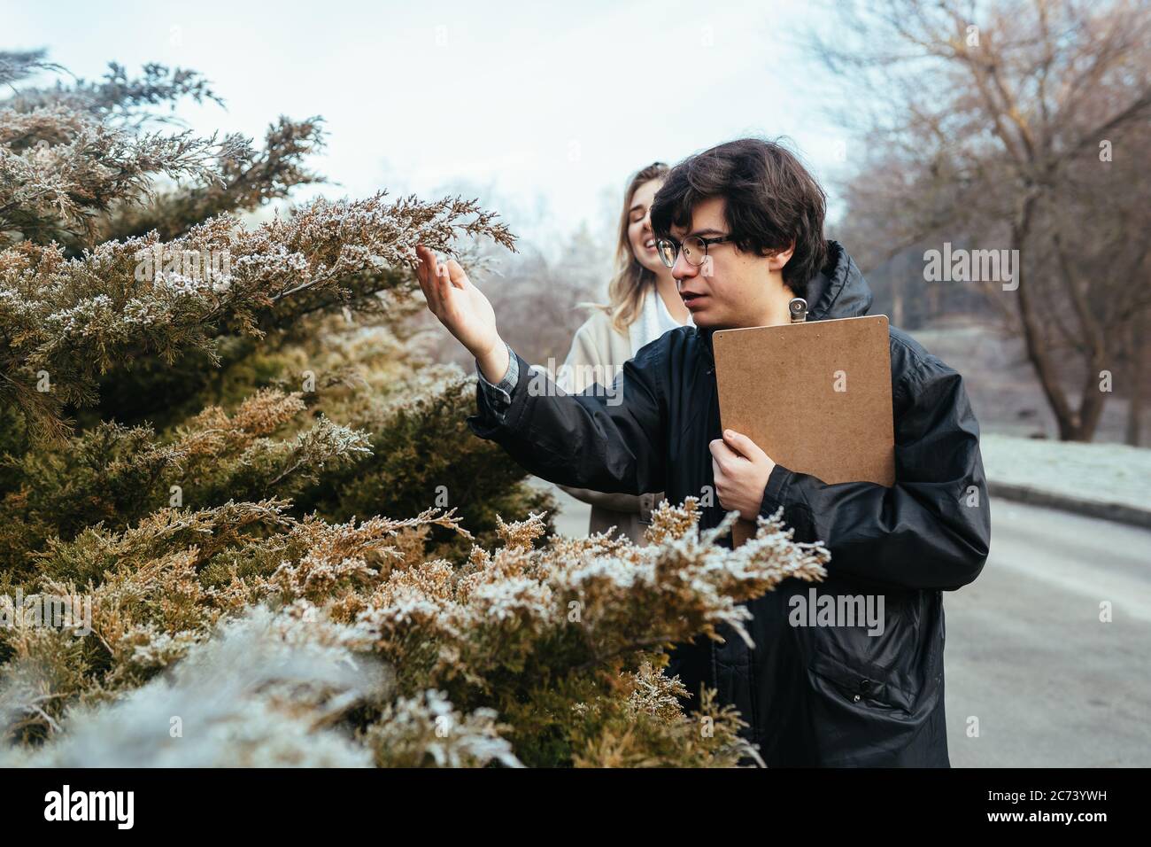 Scientists are studying plant species in the forest Stock Photo - Alamy