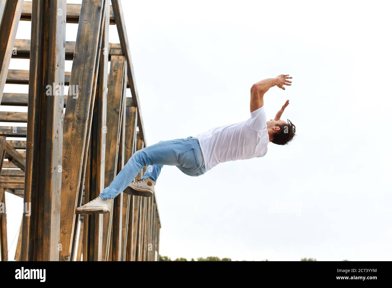 poor guy falling down on the road after accident, full length side view ...