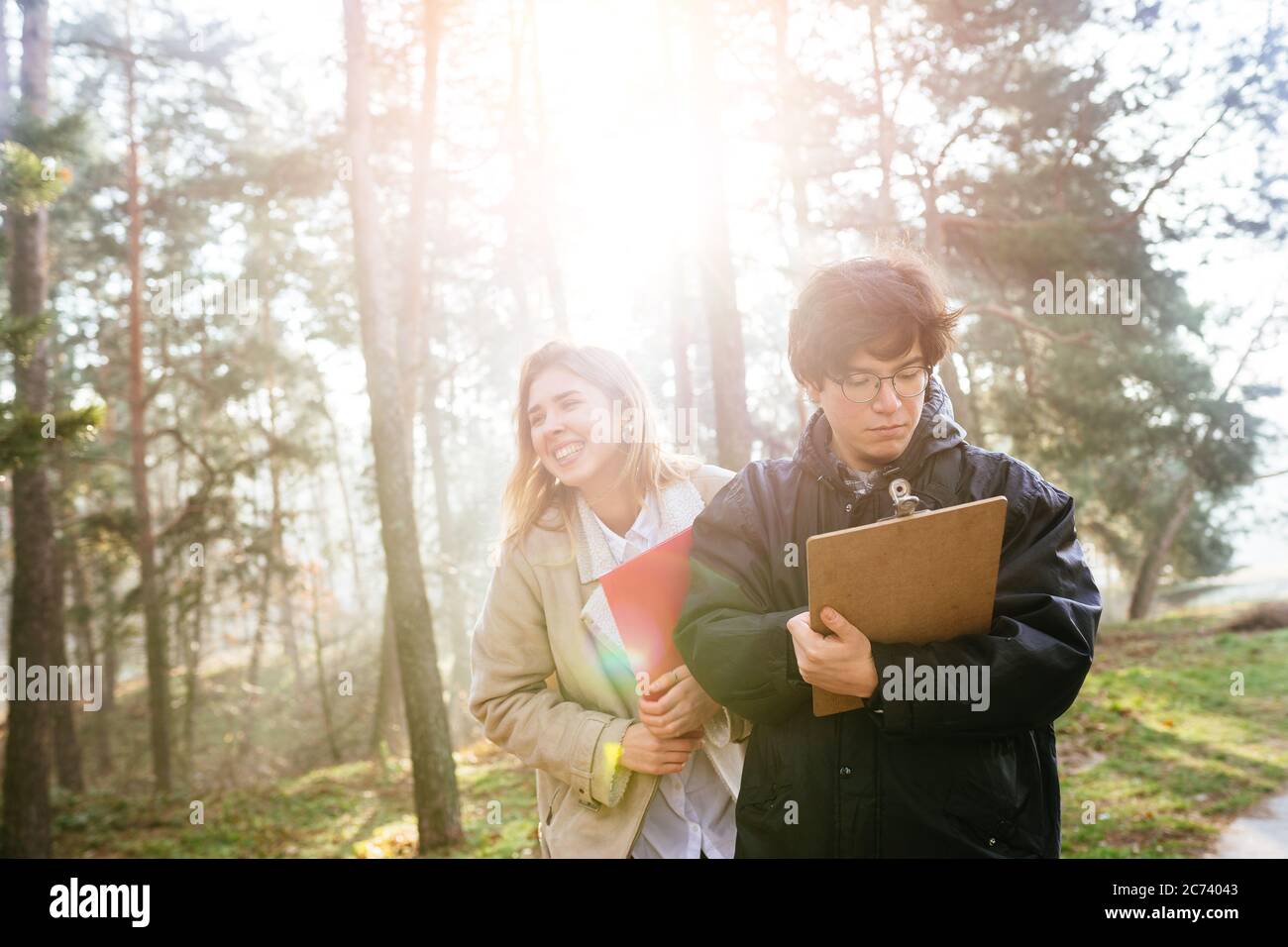 Scientists are studying plant species and inspect trees in the forest ...