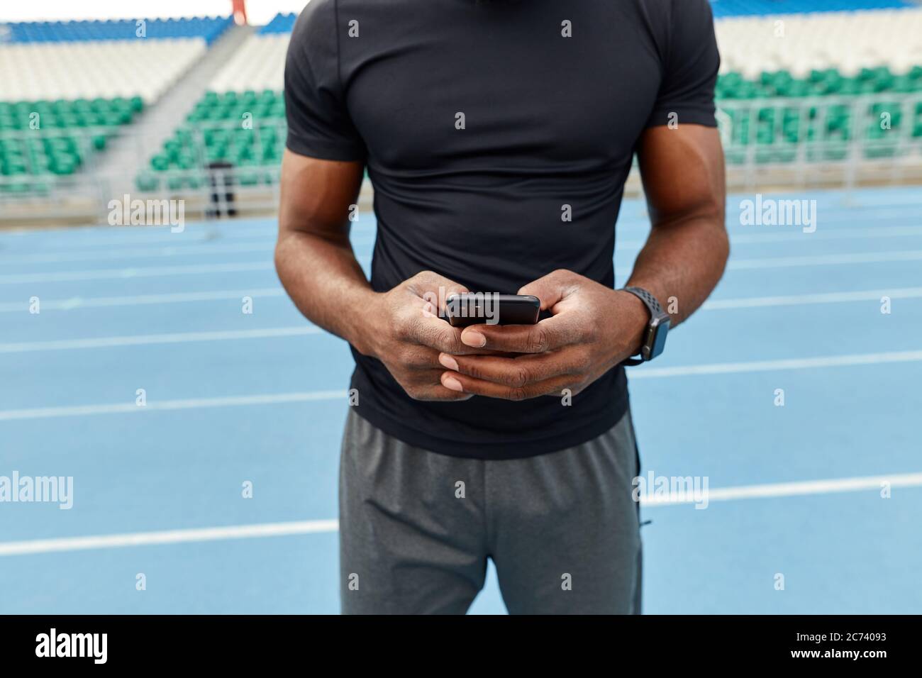 muscular well-built man typing message, making a phone call, close up ...