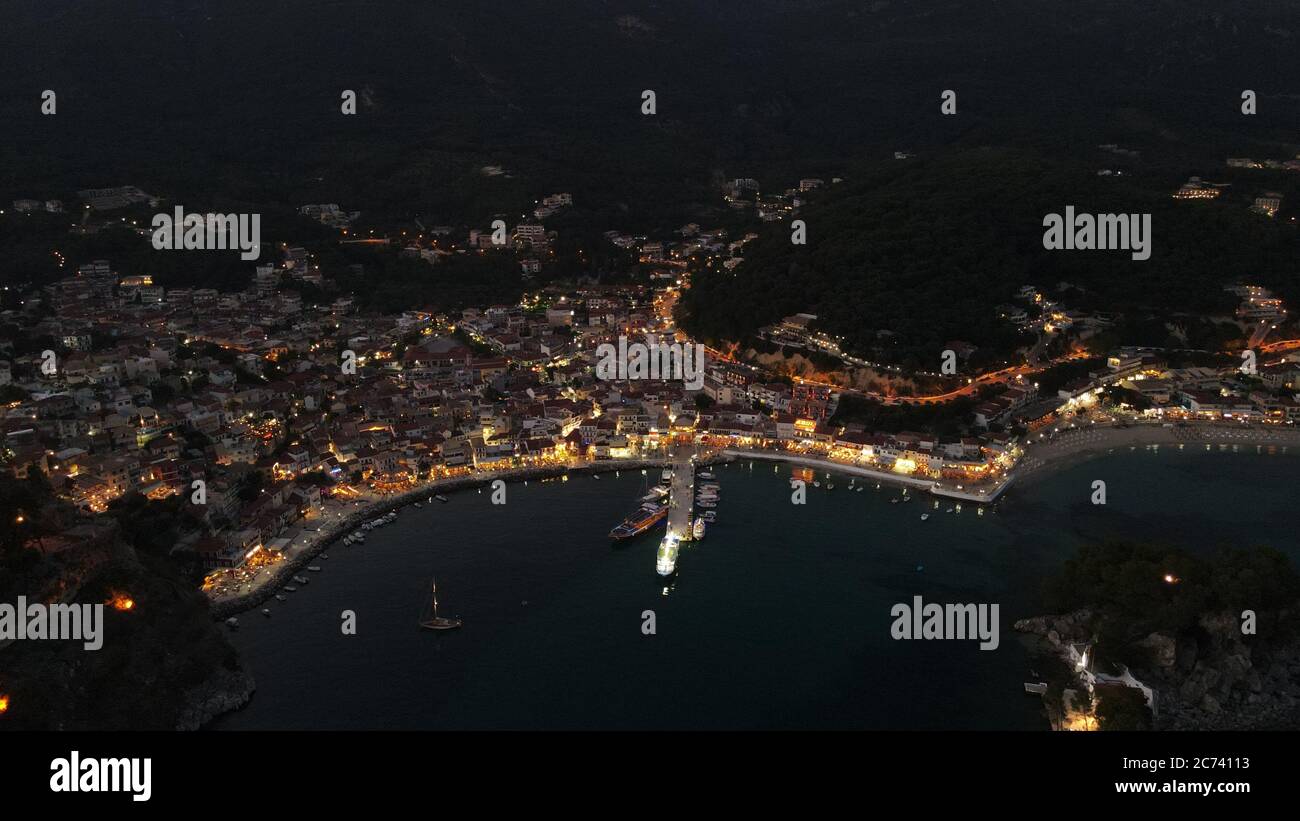 aerial night view of parga town, famous tourist destination in epirus ...