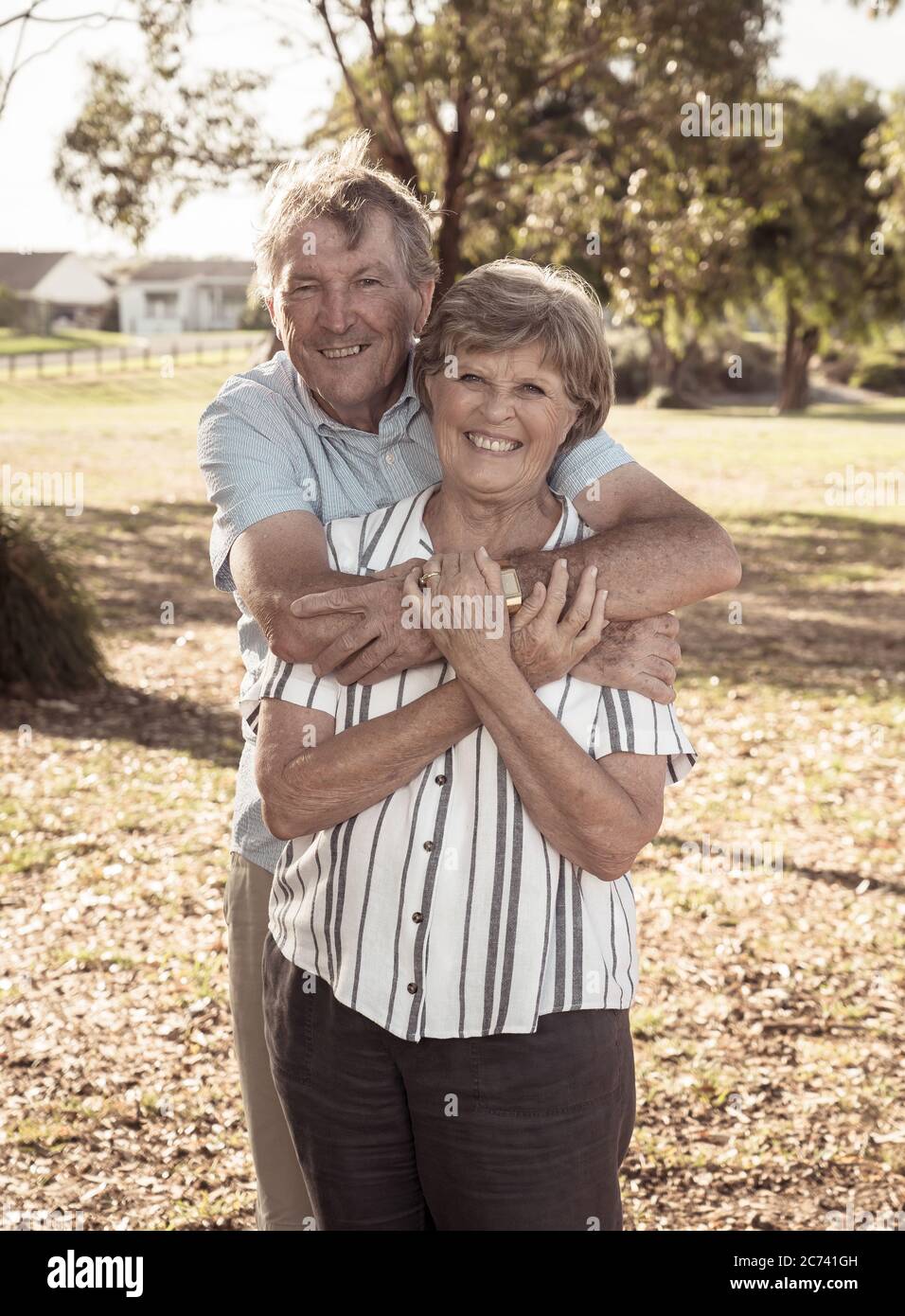 Portrait of caucasian senior couple in their 70s embracing showing love ...