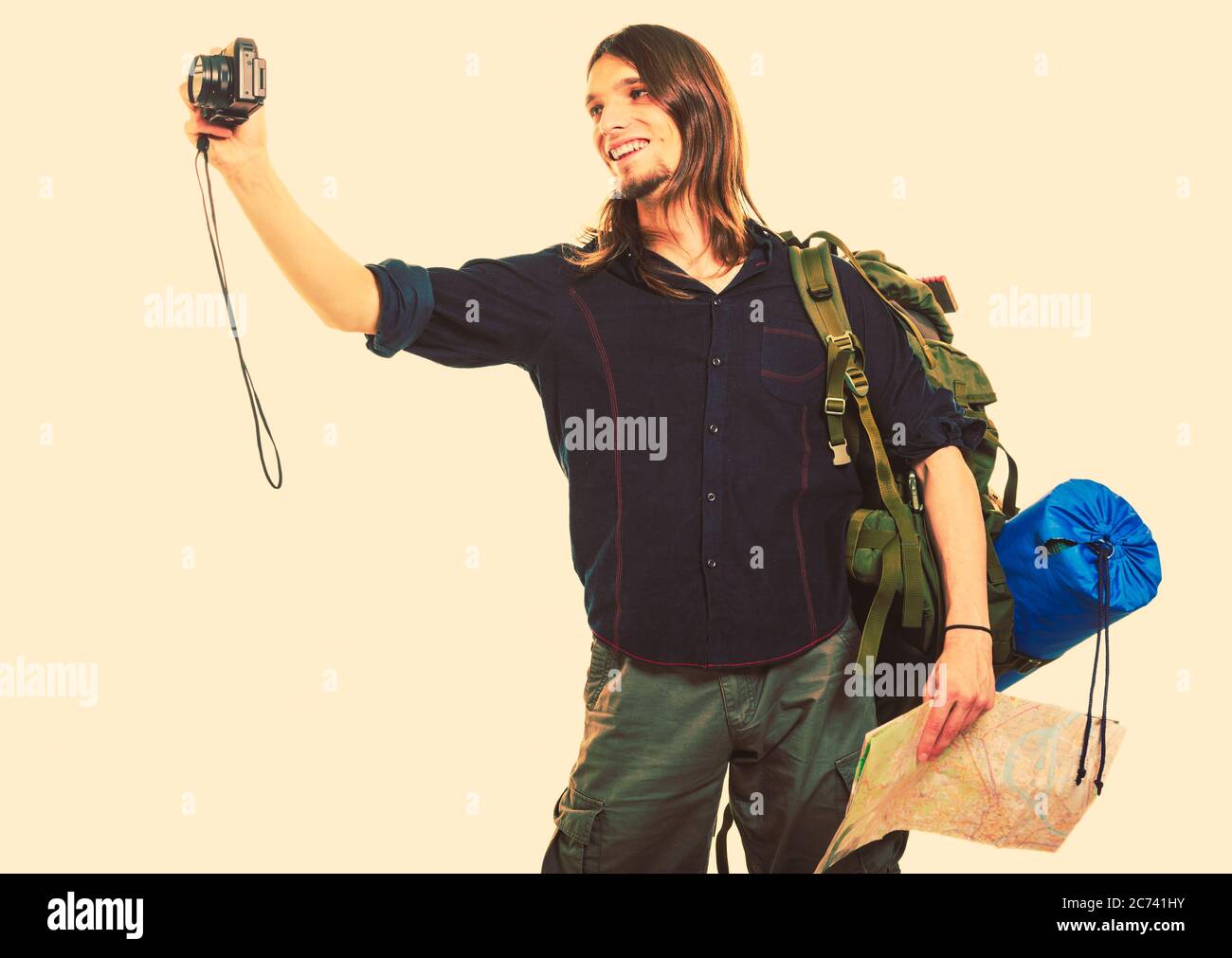 Man tourist backpacker on trip taking photo picture with camera. Young ...