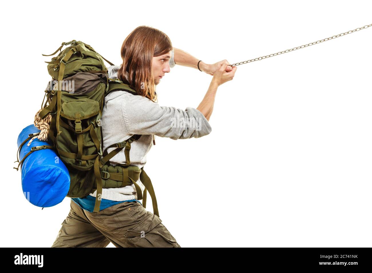 Backpacker mountaineer hiking climbing rock mountain. Young man ...