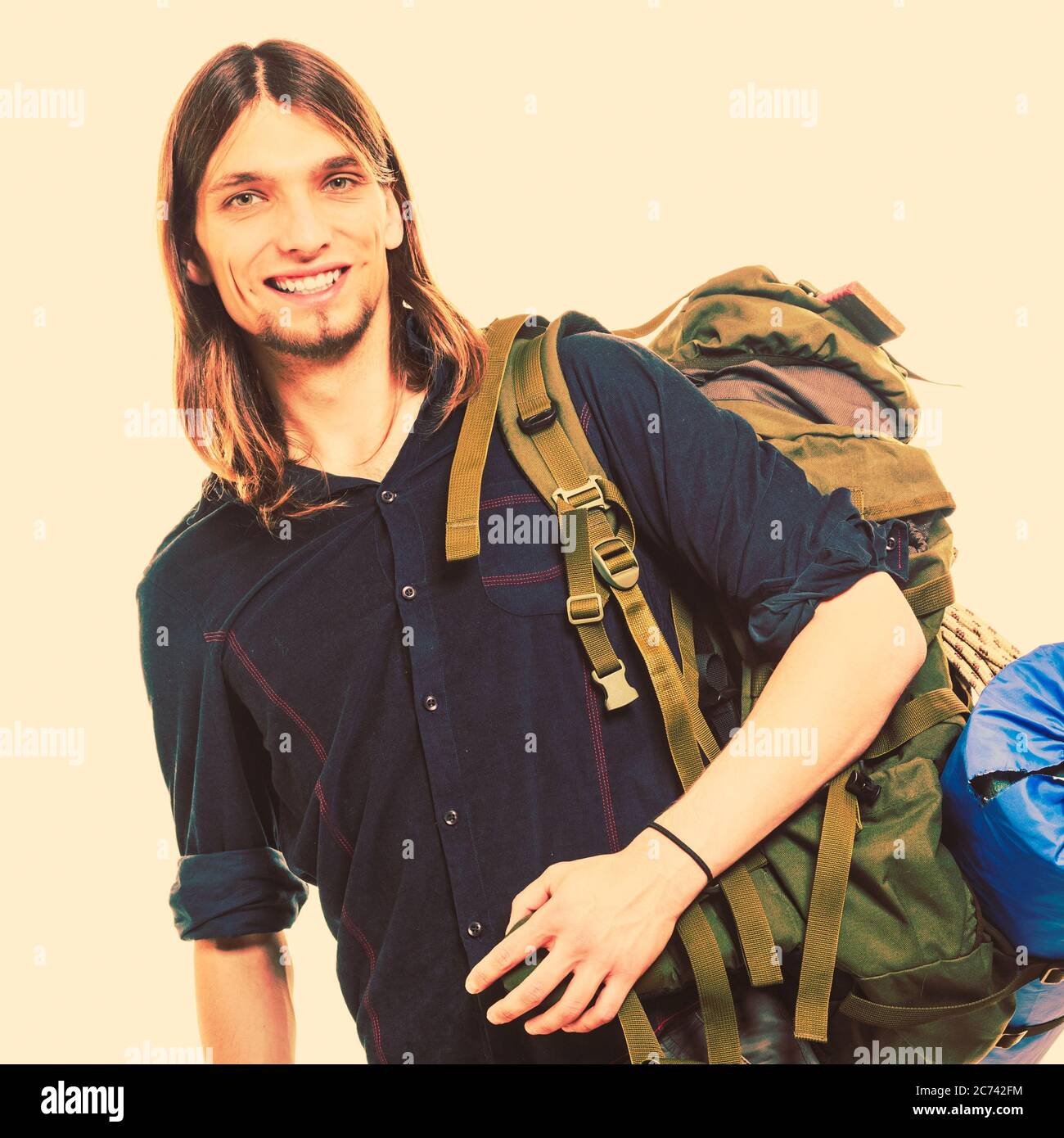 Portrait of happy smiling man tourist backpacker on trip. Young guy ...