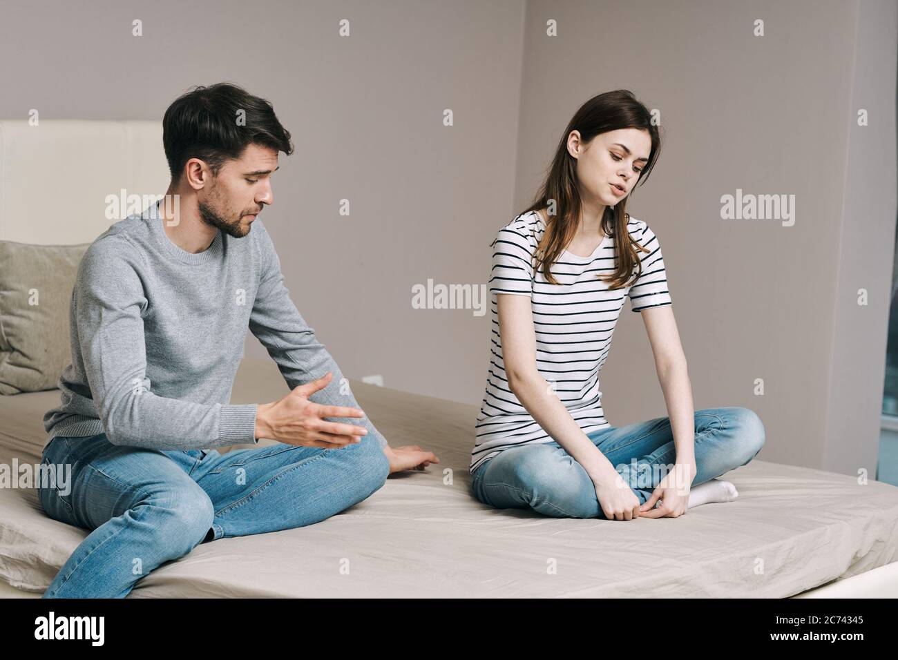 people sort things out on the bed indoors Stock Photo - Alamy