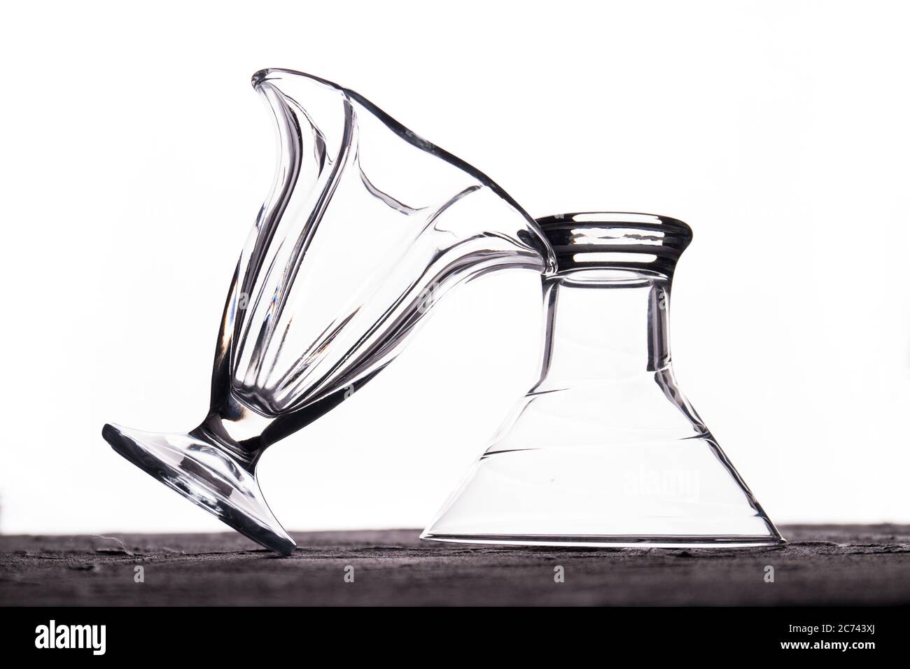 Close up two curved glass cups isolated on white Stock Photo - Alamy