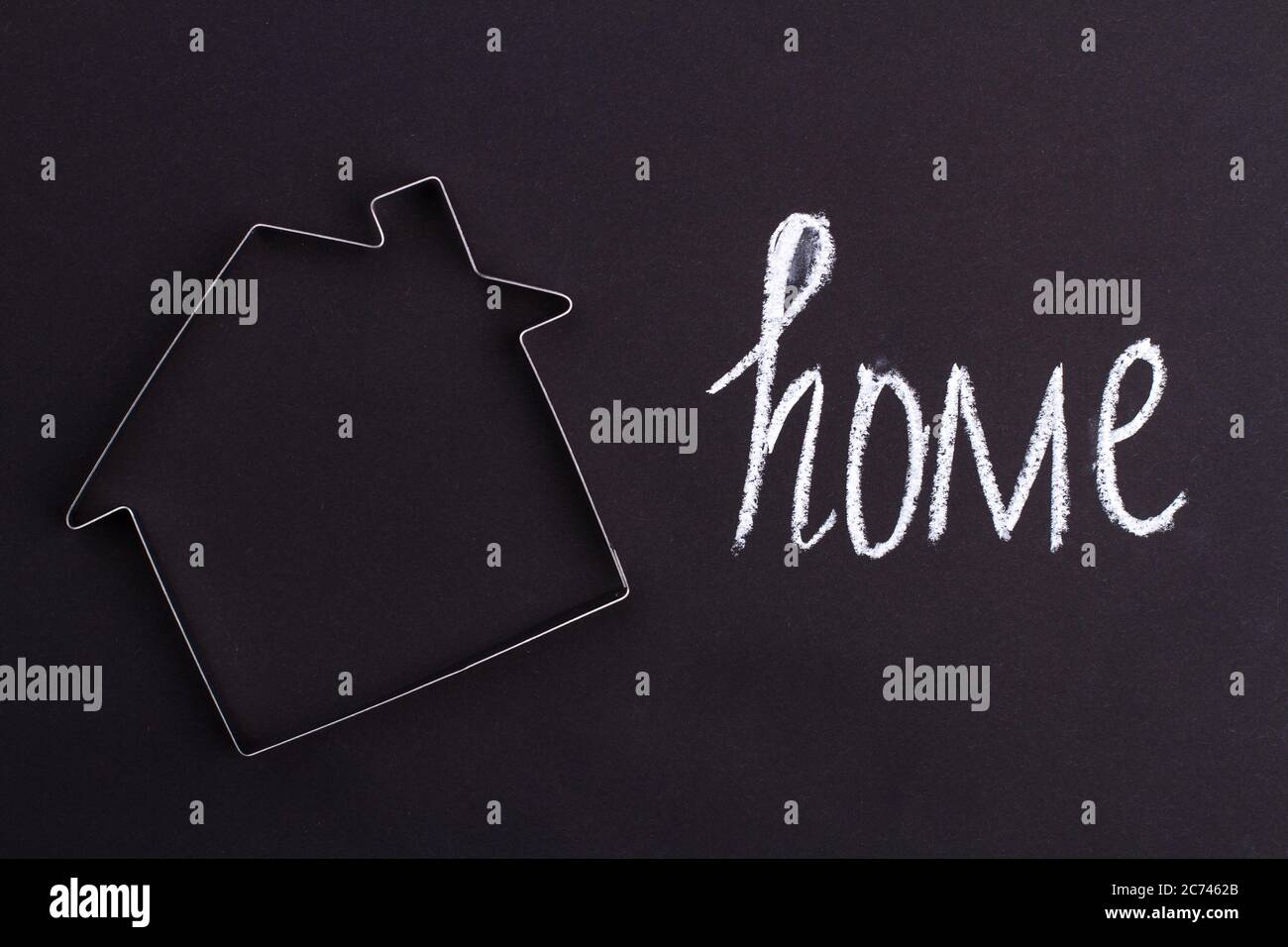 House outline and home word on black background Stock Photo - Alamy