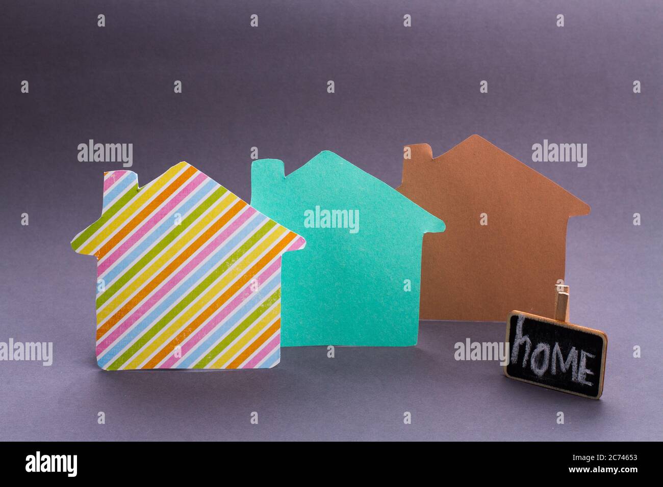 Paper houses in different colors and home concept Stock Photo - Alamy