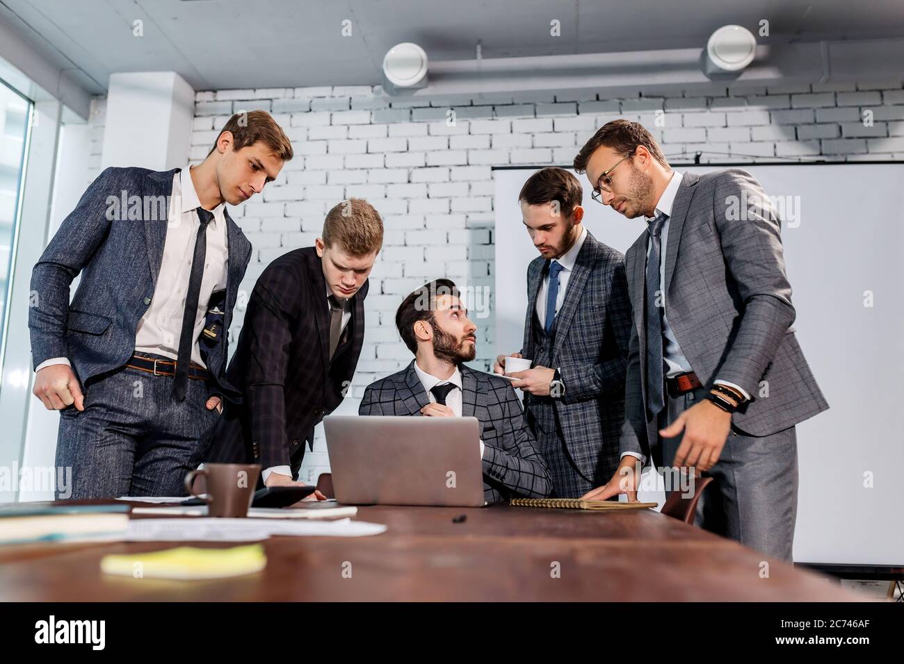 teamwork of caucasian business men in tuxedo gathering for discussion ...