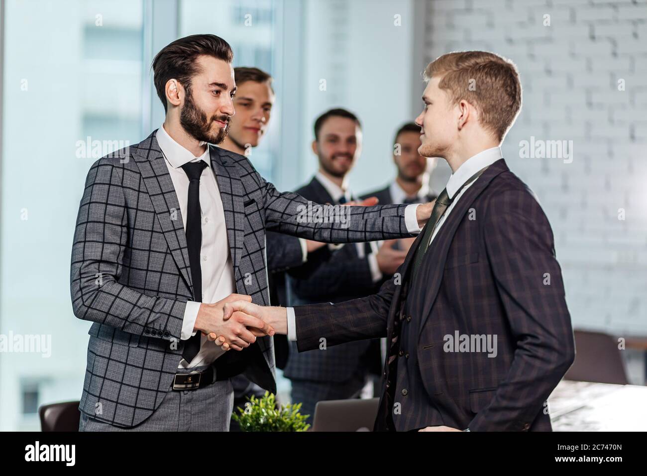 boss in stylish tuxedo congratulate best worker of company with new job ...