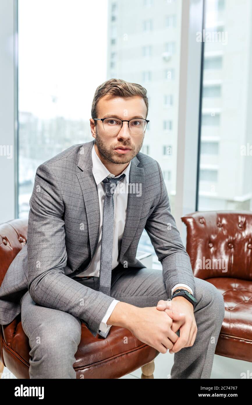 portrait of young handsome attractive caucasian business man in ...