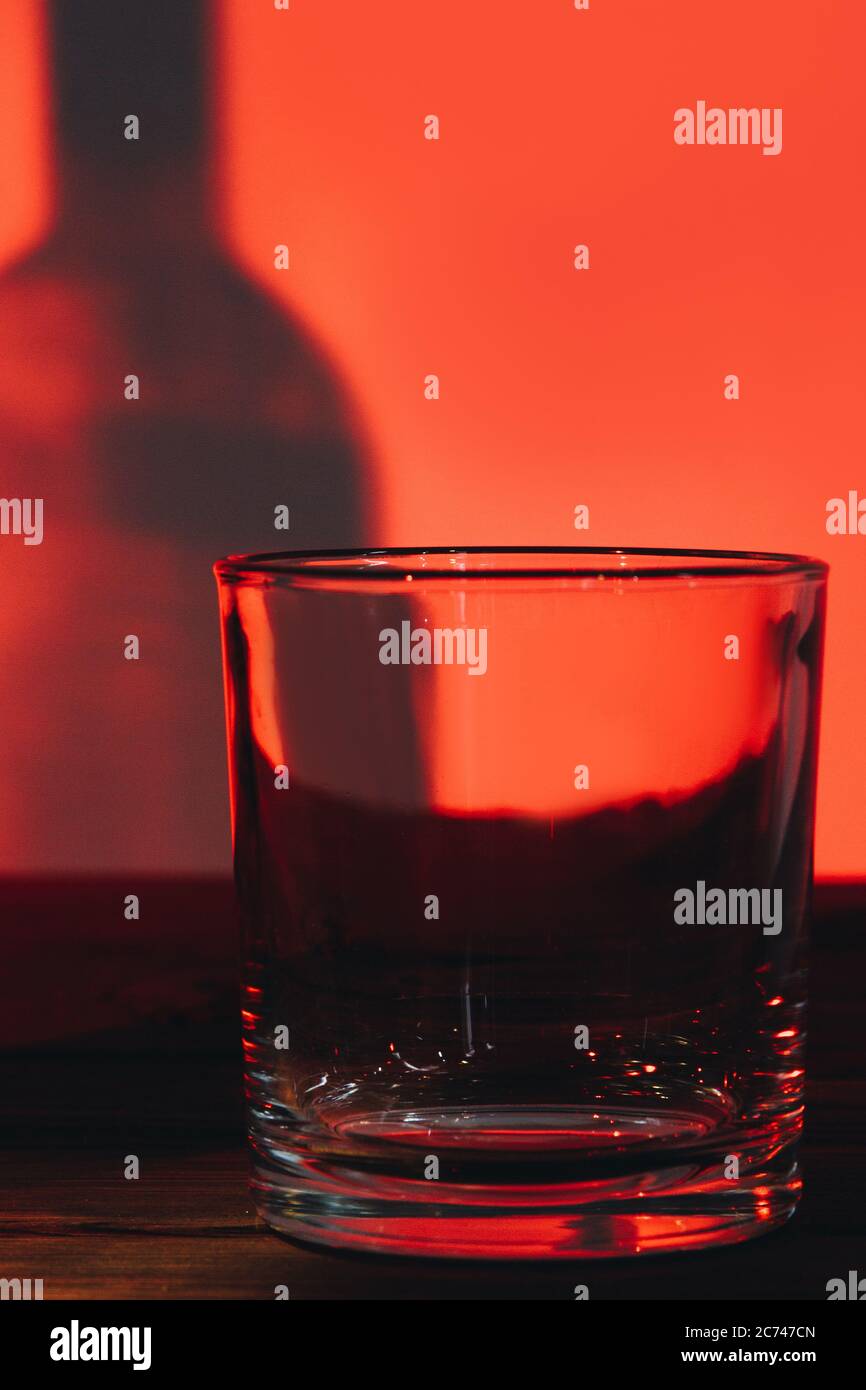 Empty transparent glass and shadow of bottle on the wall Stock Photo ...