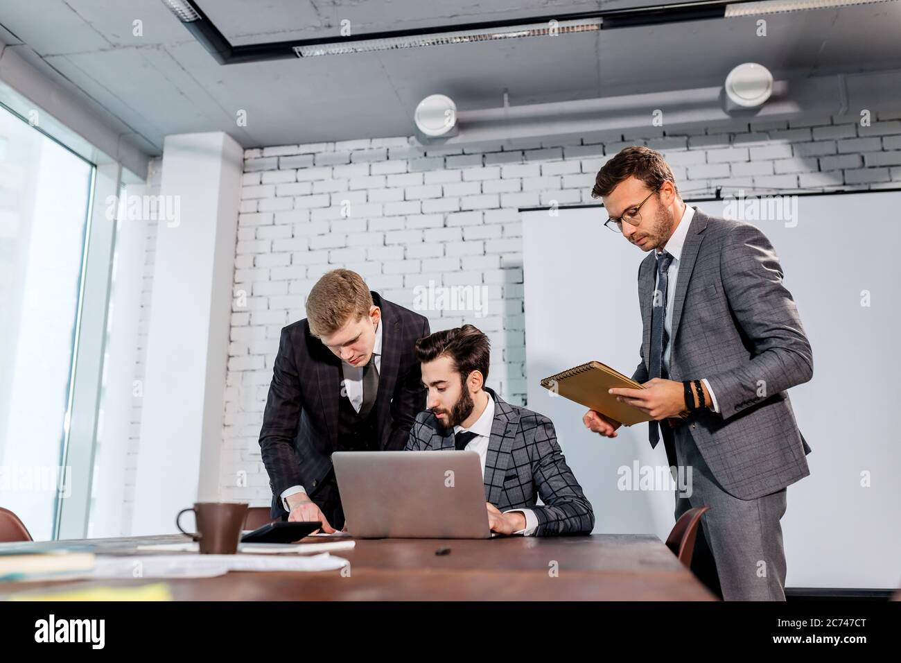 leadership and business concept. business team in modern office sit ...