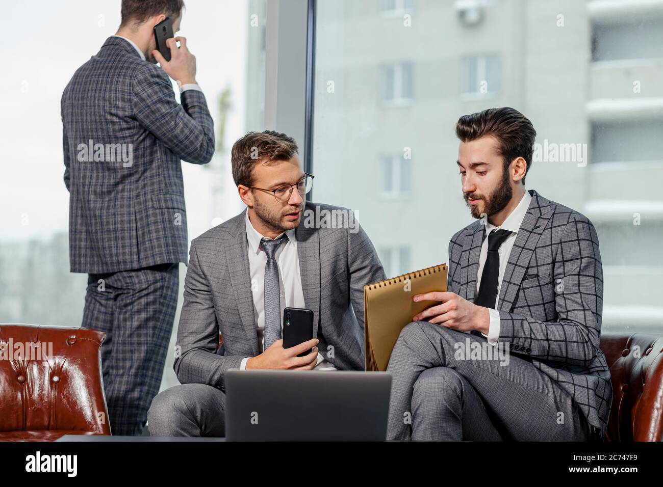 teamwork of caucasian business men in tuxedo gathering for discussion ...