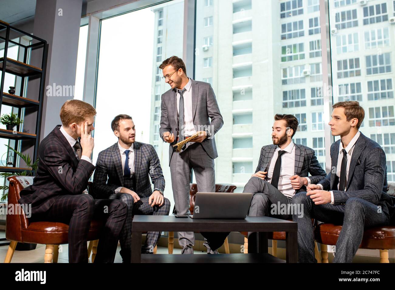 leadership and business concept. business team in modern office sit ...