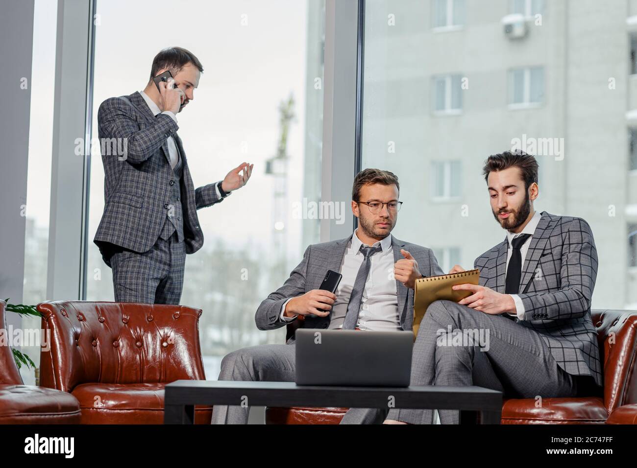 leadership and business concept. business team in modern office sit ...