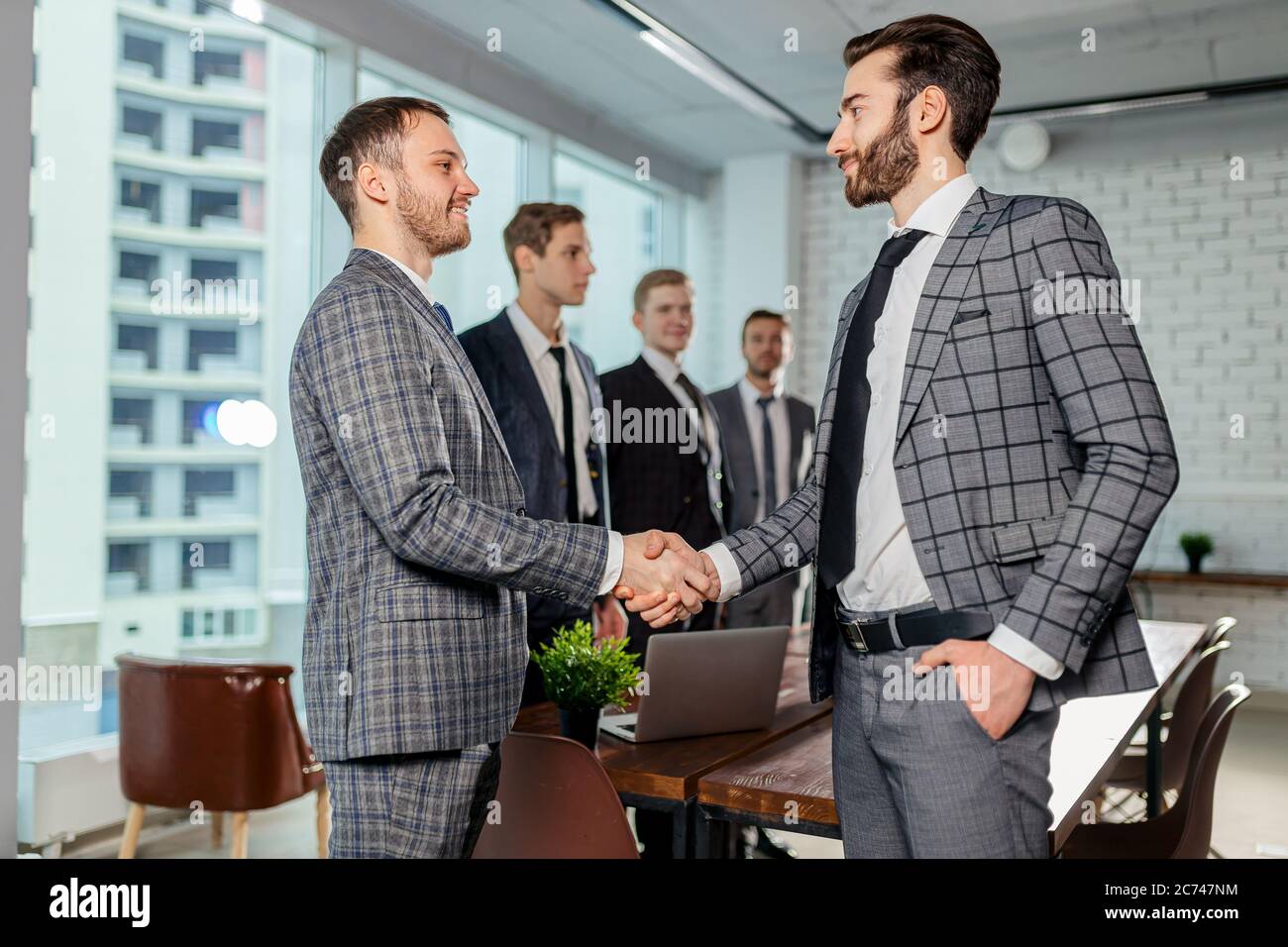 boss in stylish tuxedo congratulate best worker of company with new job ...