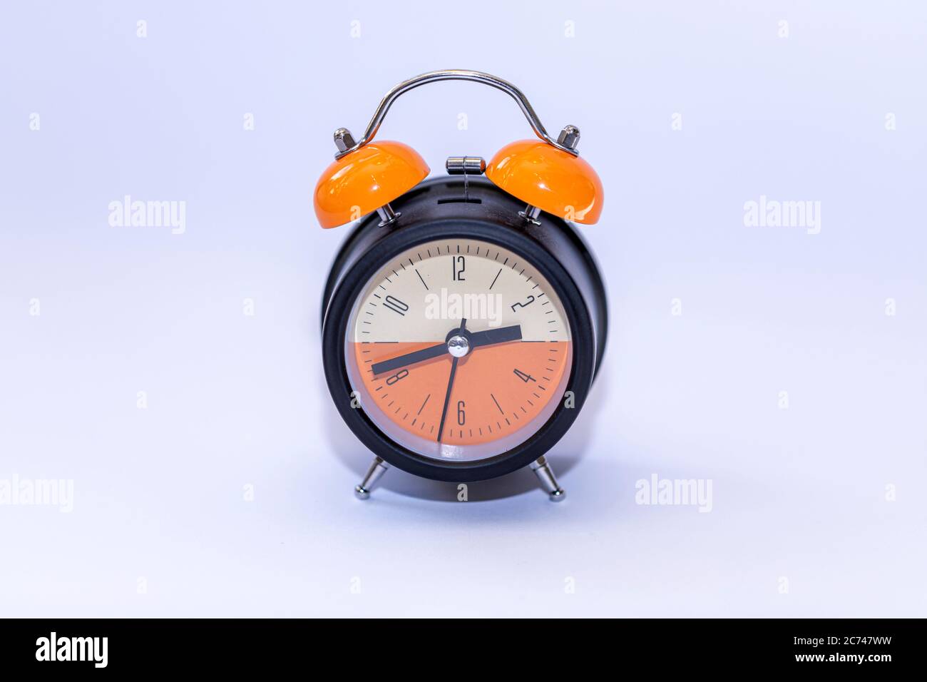 classical alarm clock ringing on white background. High resulotion ...