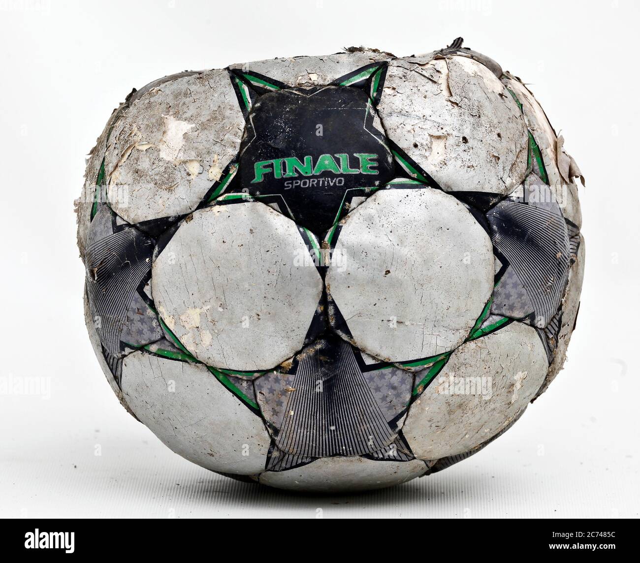 Damaged soccer ball Stock Photo - Alamy