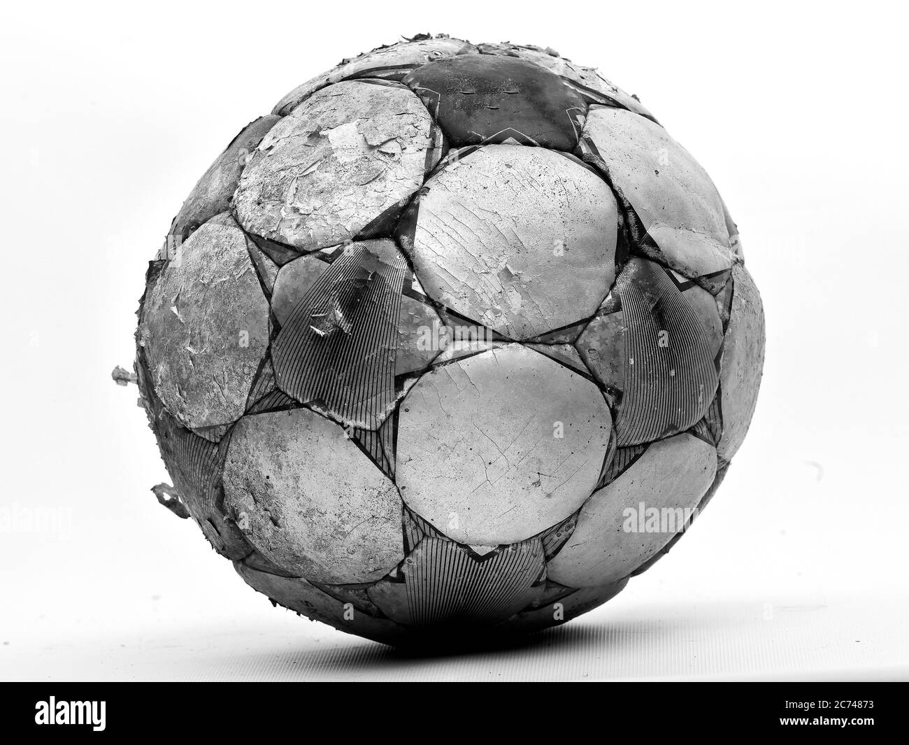 Damaged soccer ball Stock Photo - Alamy