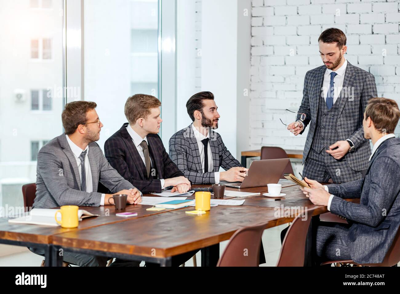 leadership and business concept. business team in modern office sit ...