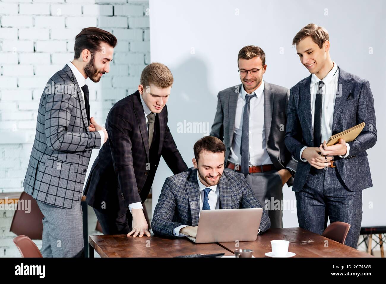 teamwork of caucasian business men in tuxedo gathering for discussion ...