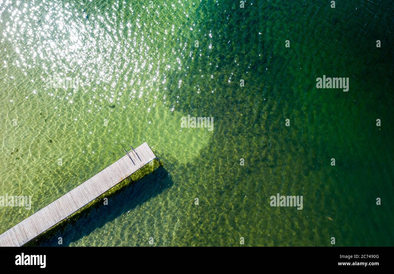 14 July 2020, Saxony-Anhalt, Roßbach: A bathing jetty leads from the ...