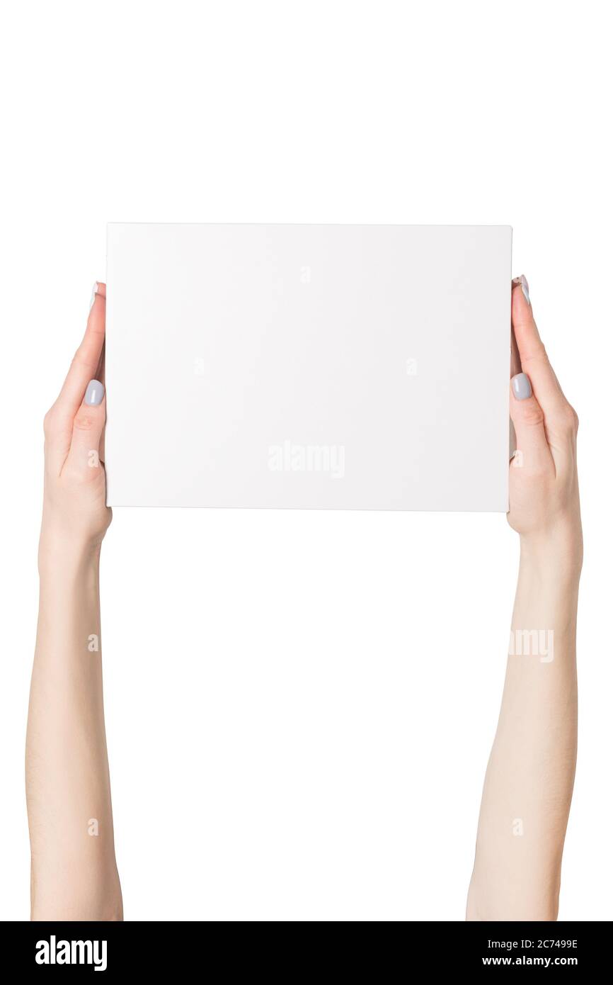 White rectangular box in female hands. Top view. Isolate Stock Photo ...