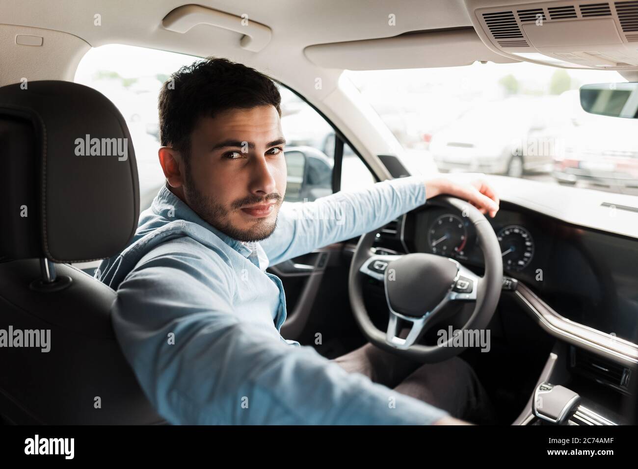 Business man driving a luxury car Stock Photo - Alamy