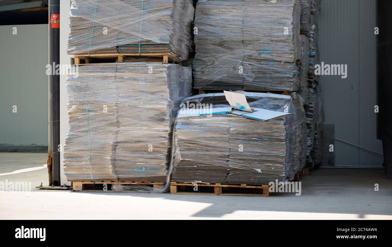 Shipment cartons box on pallets and wooden case on hand lift in ...