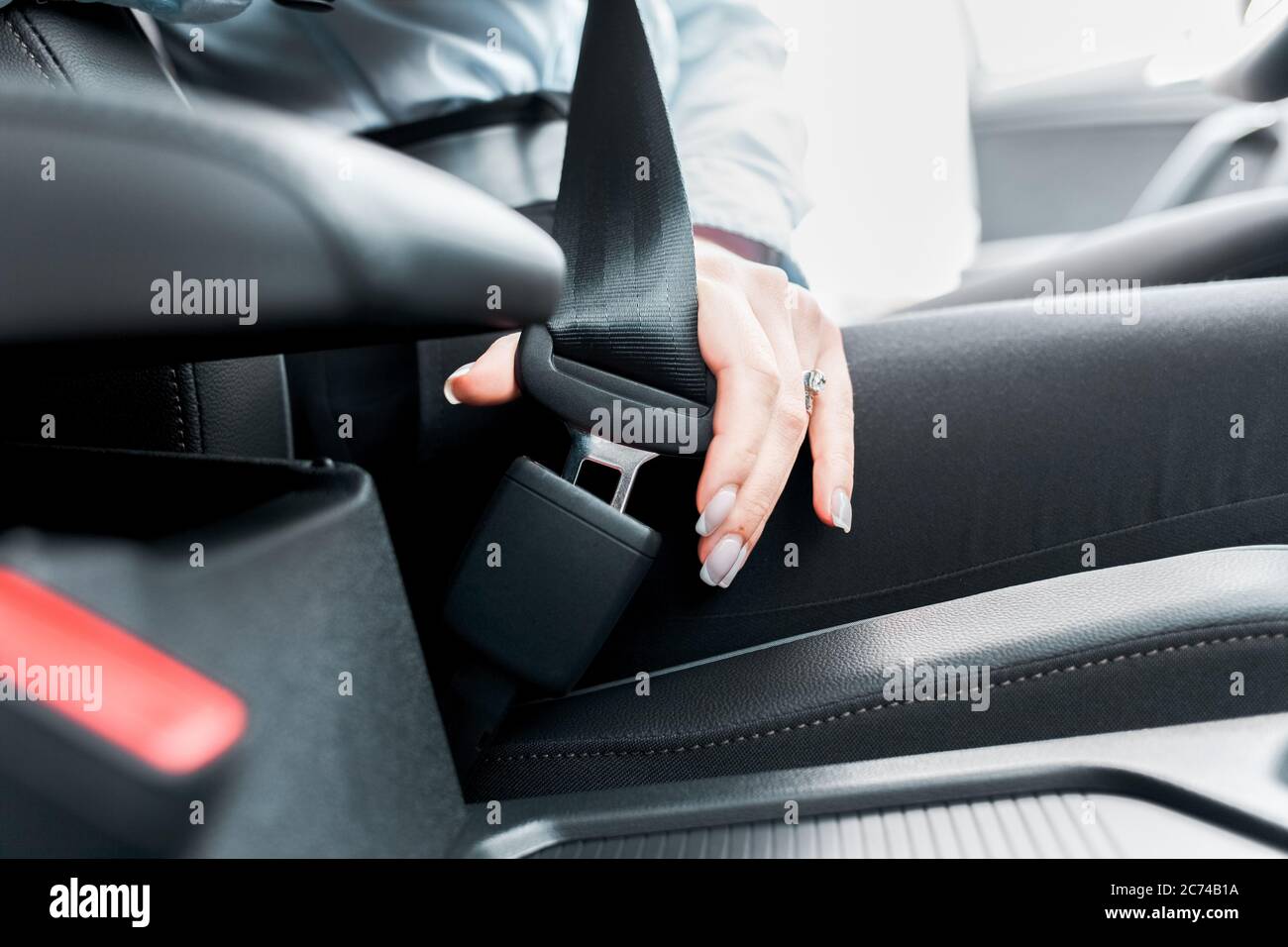 Woman fastens seat belt hi-res stock photography and images - Alamy