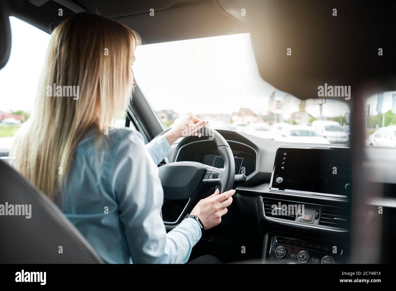 Business woman driving a modern car Stock Photo - Alamy