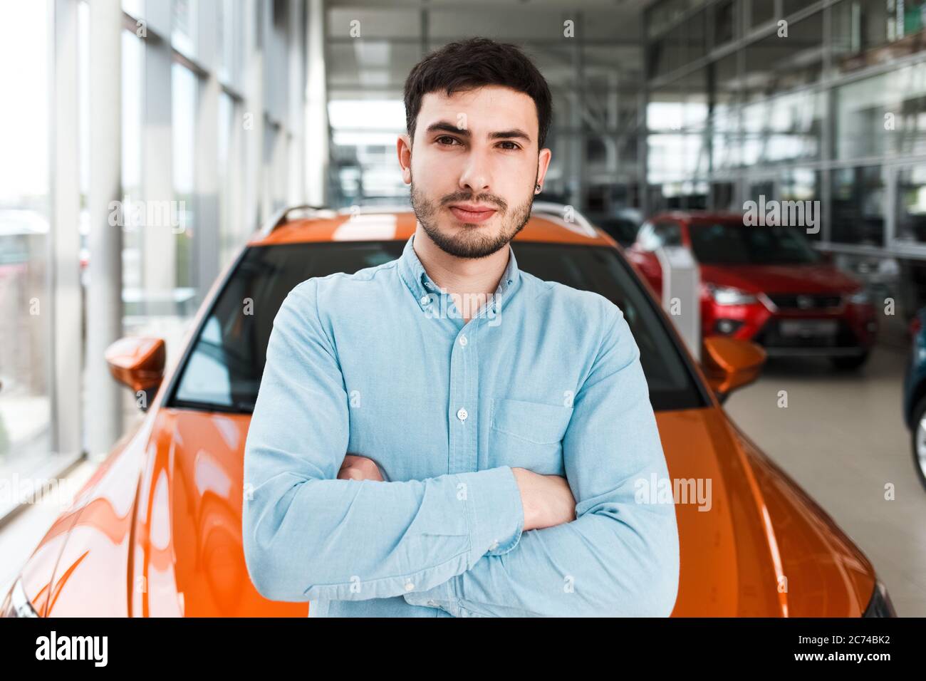 Male client at a car dealership Stock Photo - Alamy