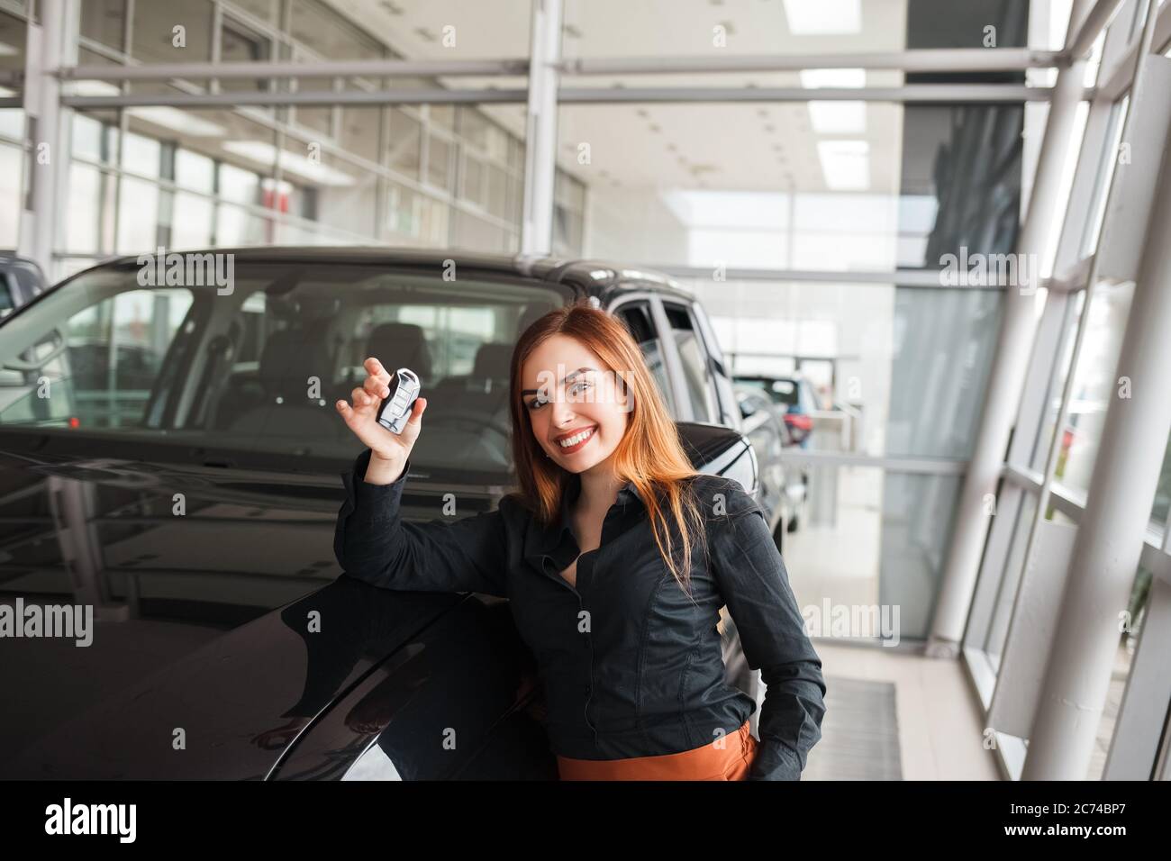 Happy girl with key in hand hi-res stock photography and images - Alamy