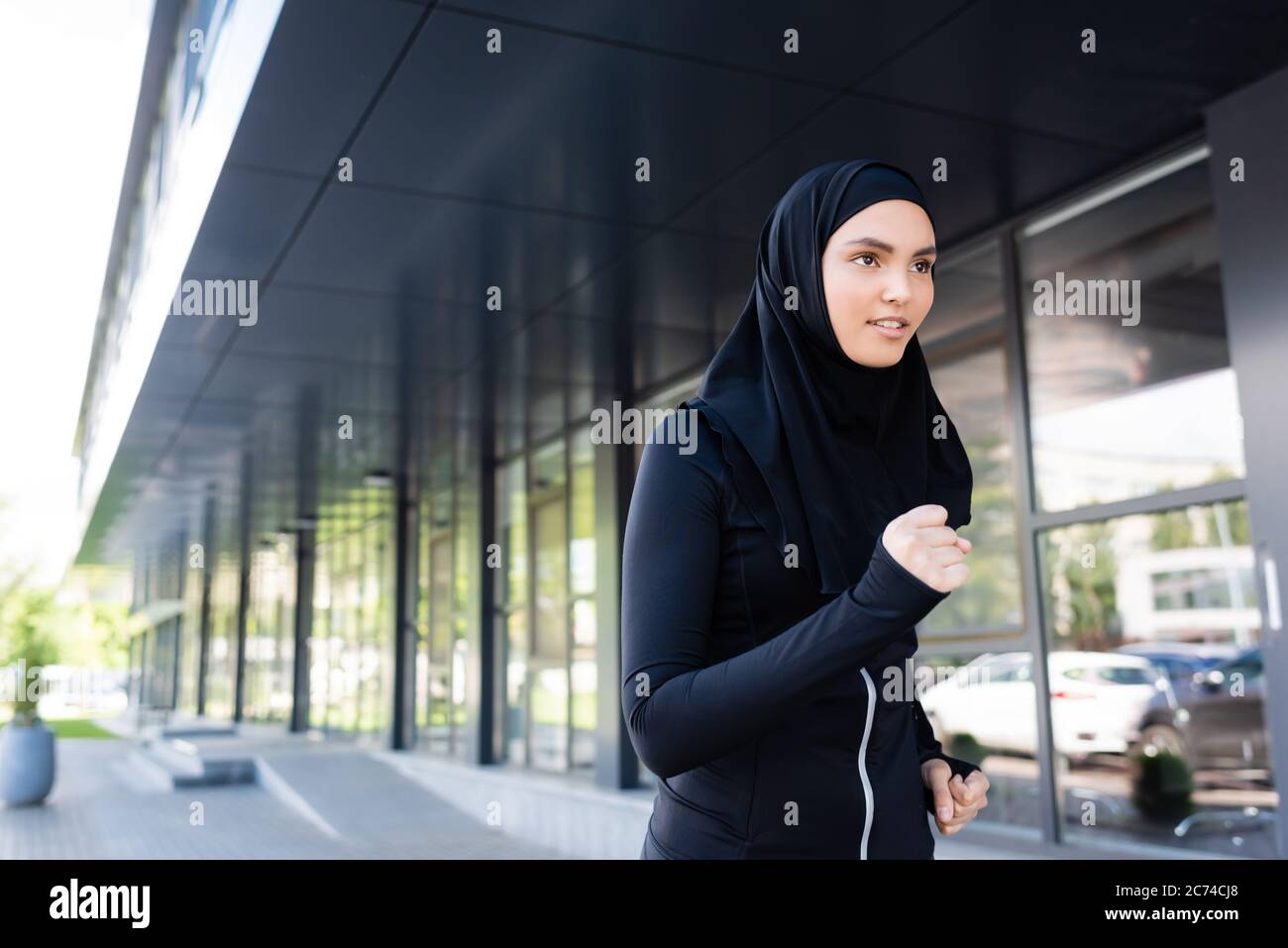 Muslim woman running outside hi-res stock photography and images - Alamy