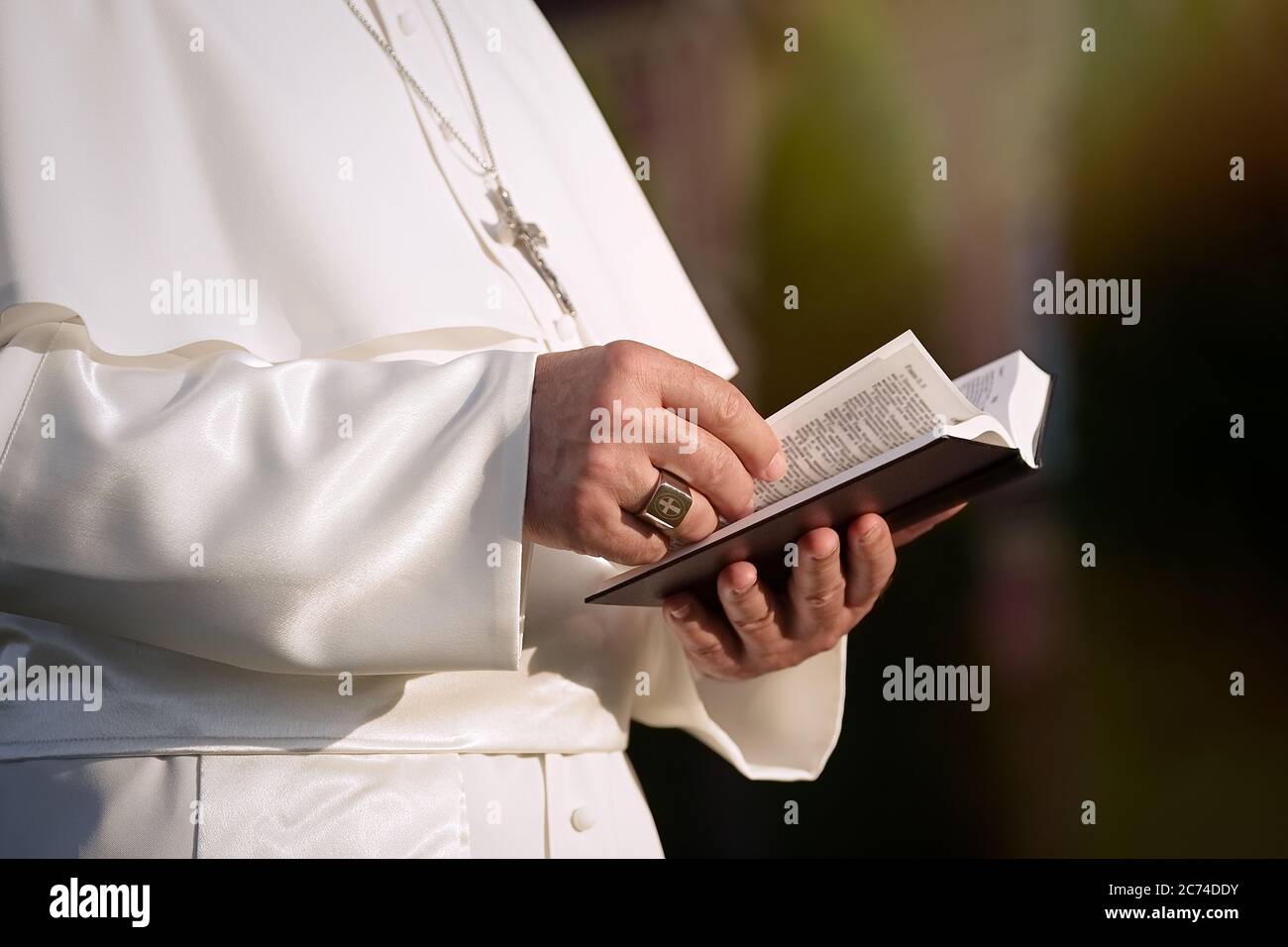 Church father reading bible hi-res stock photography and images - Alamy