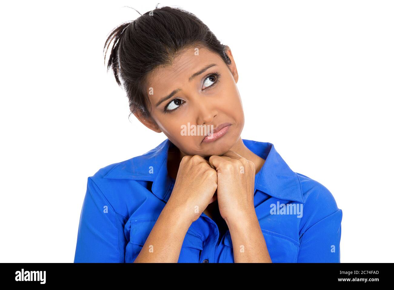 Portrait of an upset sad bothered young woman resting face on fist ...