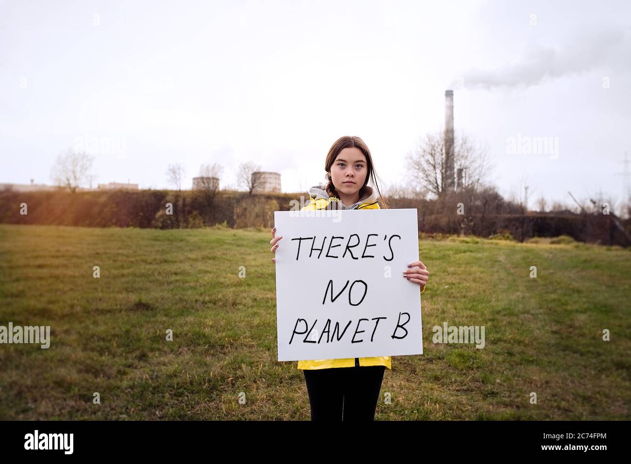 Teenager girl holding placard during global strike for climate change ...
