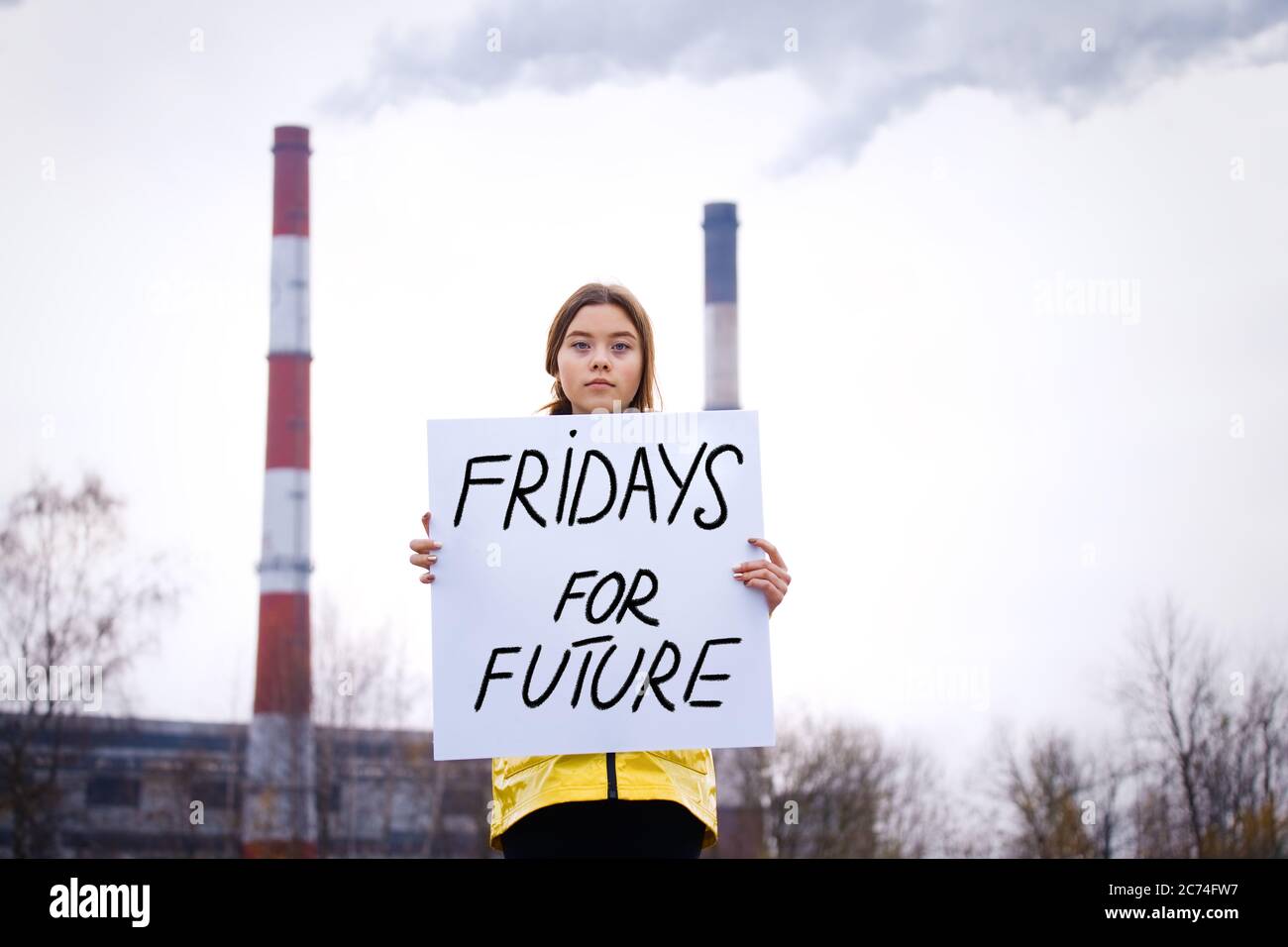 Teenager girl holding placard during global strike for climate change ...